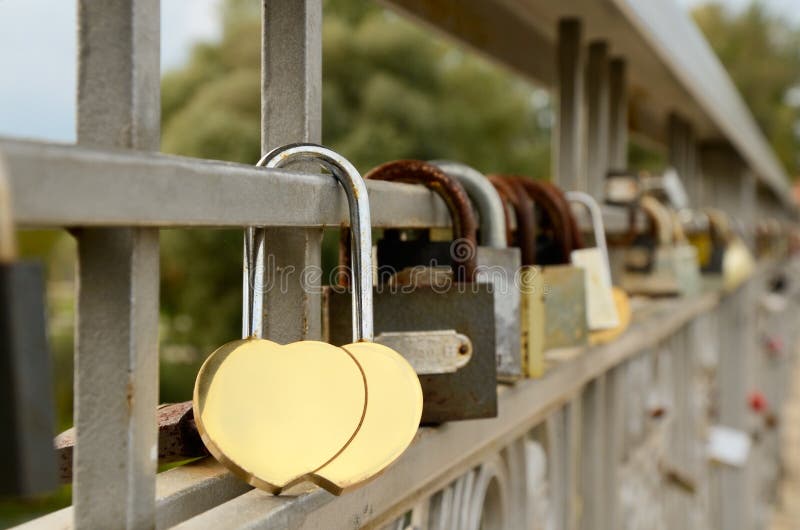 Lock Hangs on a Lattice Bridge Stock Image - Image of locking, heart ...