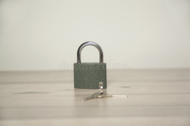 Lock and key on desk. stock image. Image of business - 218953921