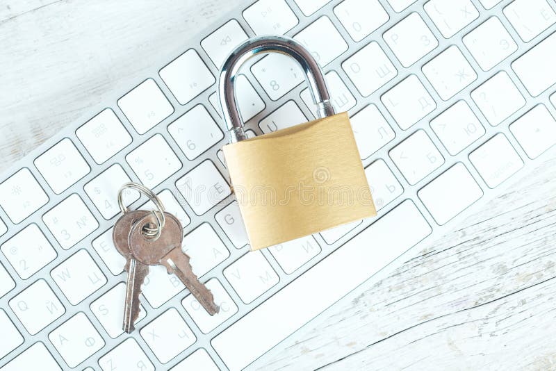Lock and Key on Keyboard on Desk Stock Photo - Image of keyboard ...