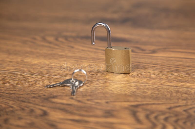 Lock with key on the table stock photo. Image of table - 208036292