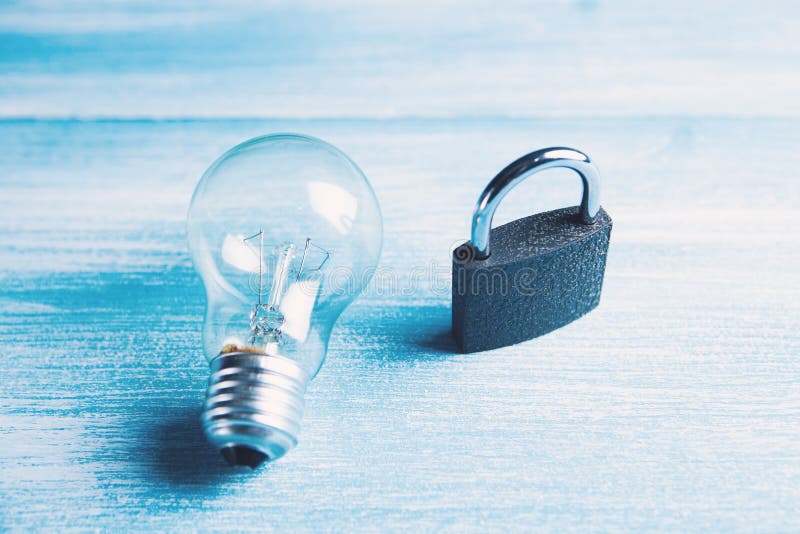Lock and Light Bulb on the Table Stock Image - Image of modern, padlock ...