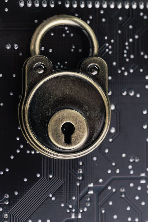 Lock Pad on Dark Black Computer Circuit Board with Solder, Safety and ...