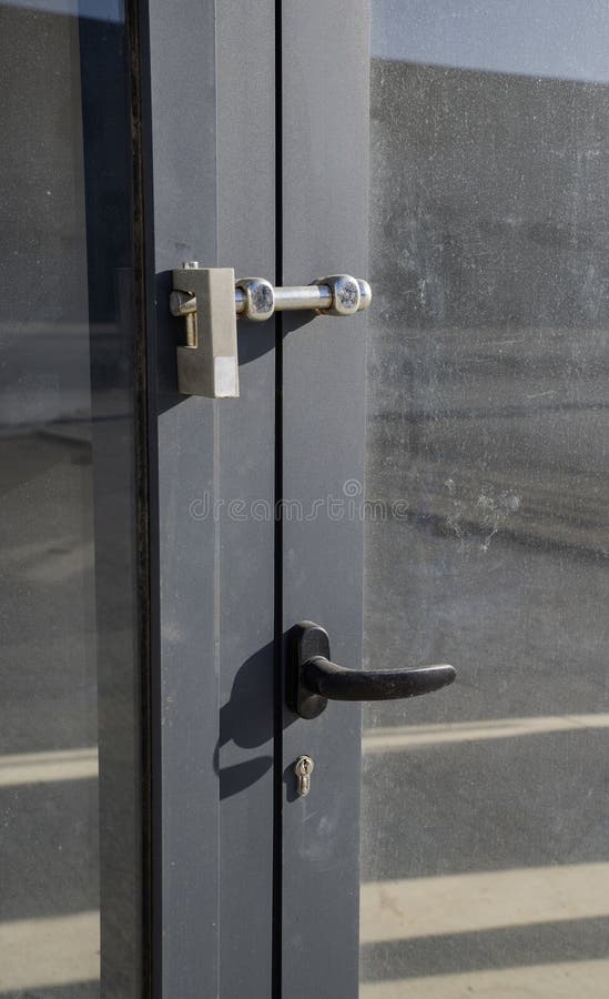 Lock on a warehouse doors stock image. Image of construction - 366847795