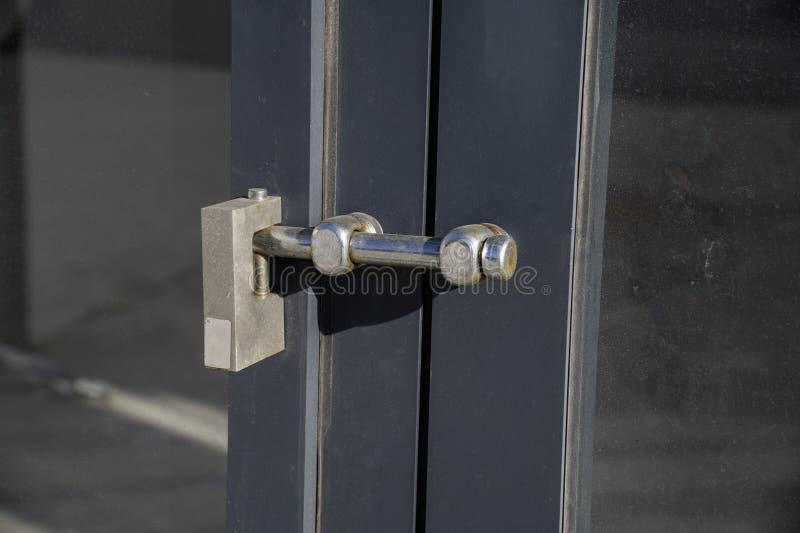 Lock on a warehouse doors stock image. Image of knob - 366740911