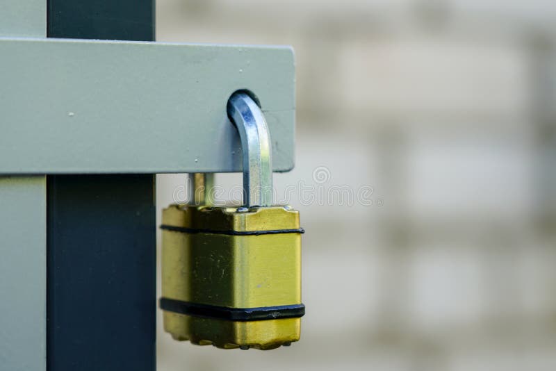 Locked Padlock with Yellow Body Hangs in the Door Loop Stock Image ...