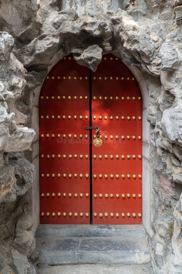 Locked Red Door in Rock stock photo. Image of autumn - 239078890