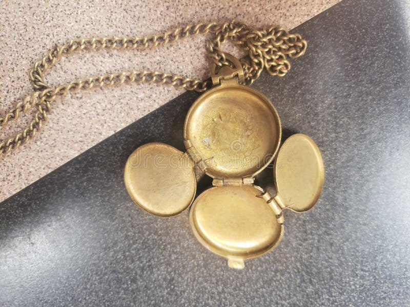 Locket 4 way stock photo. Image of chain, brass, locket - 227721364