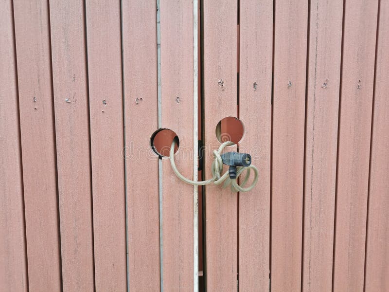 Locking Security Cable Tied between Two Wooden Doors Stock Photo ...