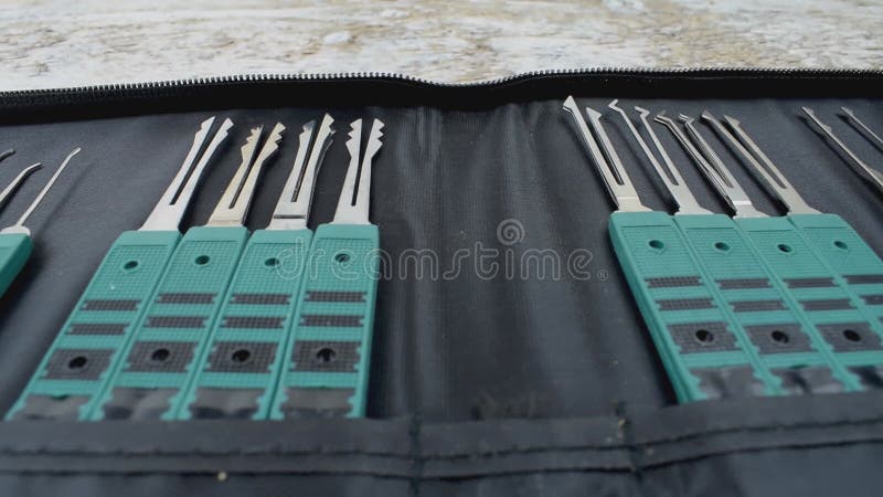 Lockpicking Tools Kit in a Pouch on White Wood Surface. Stock Video ...