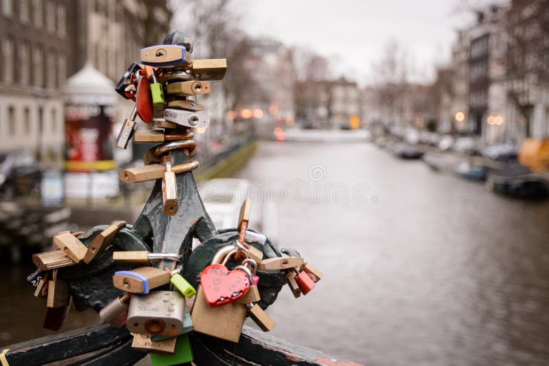 Locks on a Balustrade Bridge Over a Canal in Amsterdam Netherlands ...