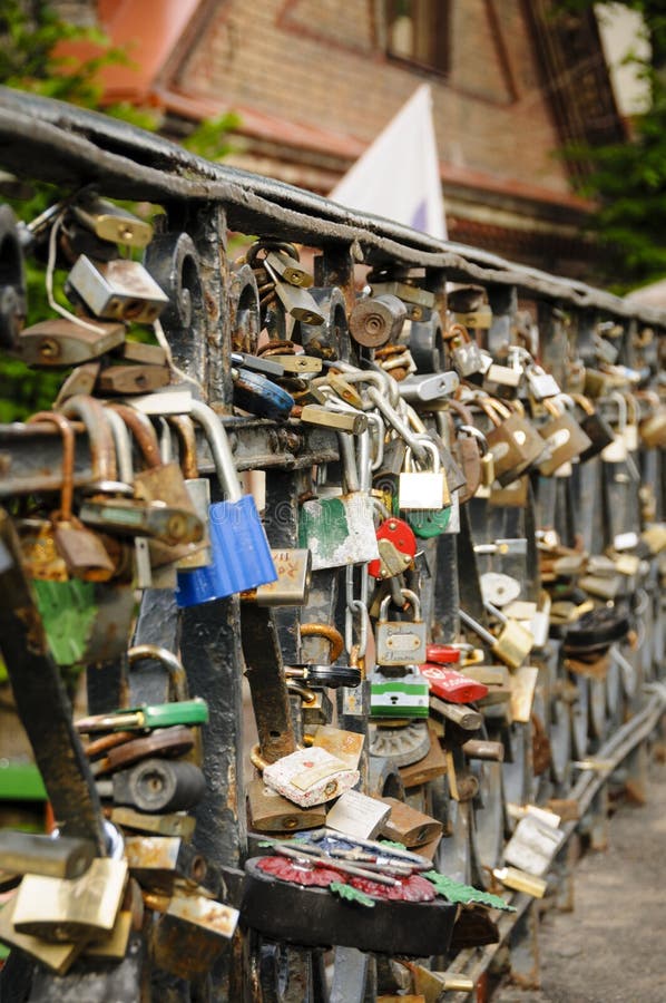 Locks on a bridge railing stock photo. Image of baltic - 53938596