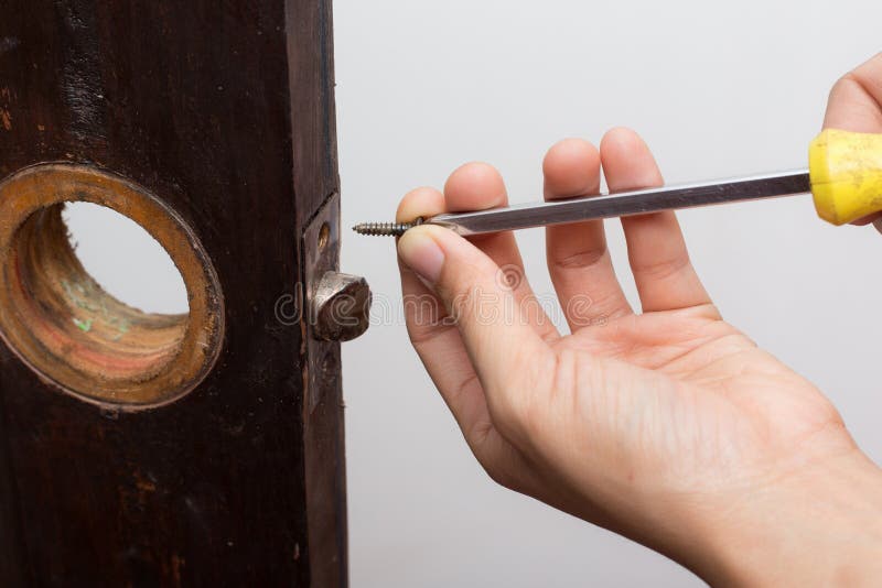 Locksmith Fitting New Lock To Outside Door Stock Image - Image of ...