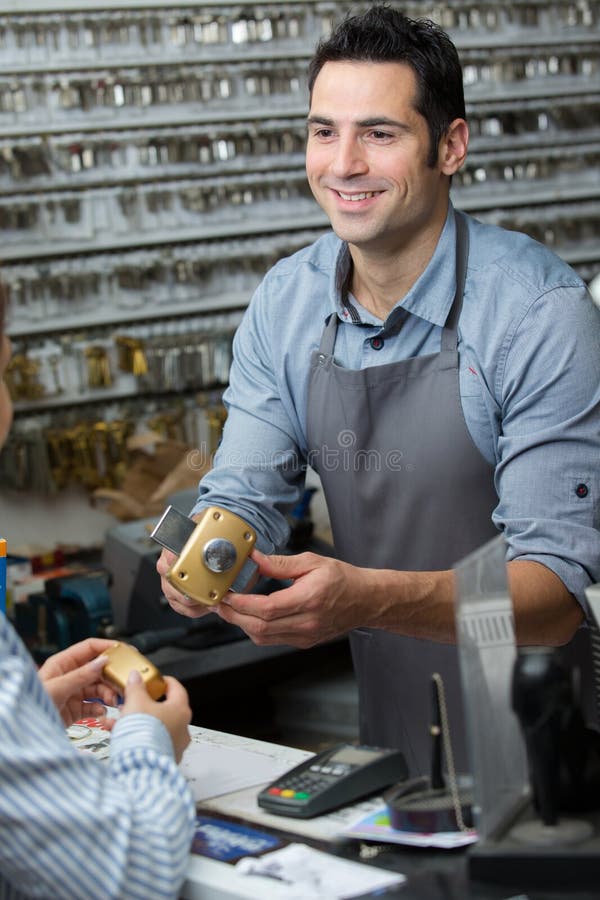 Locksmith Giving Locking Mechanism Part To Client Stock Photo - Image ...