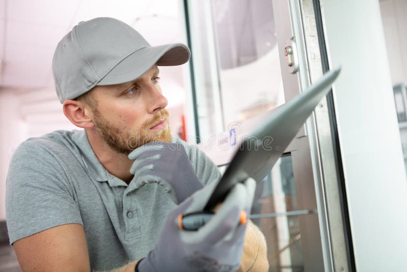 Locksmith Holding Tablet and Screwdriver Stock Image - Image of ...