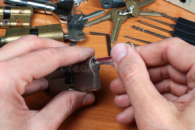 Locksmith Inserts Key in Cylinder Lock Stock Photo - Image of ...