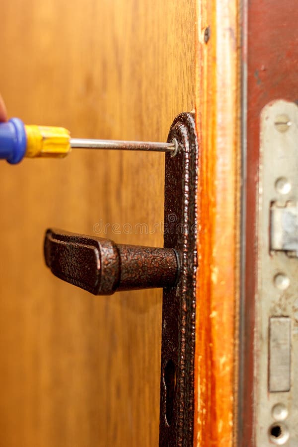 Locksmith Making Installation of Door Lock with Screwdriver. Stock ...