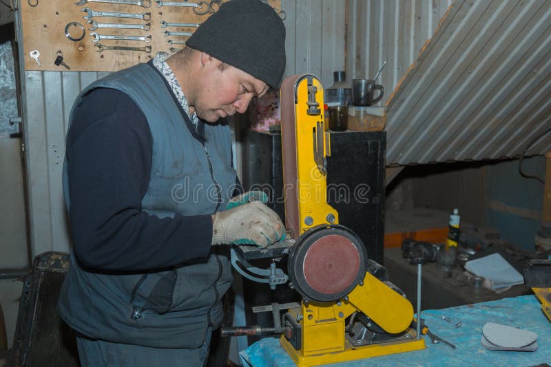 Locksmith Processes a Part on an Emery Machine Stock Image - Image of ...