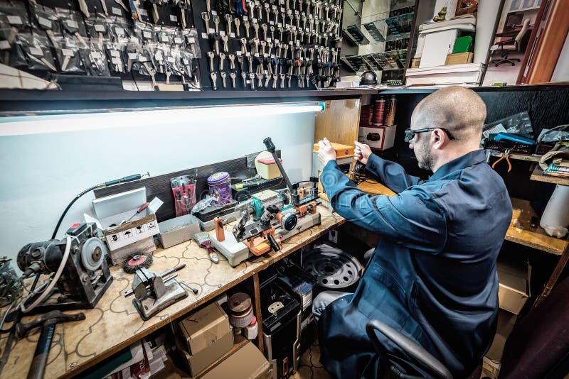 Locksmith Working on Key Duplicating Machine in Workshop Stock Image ...