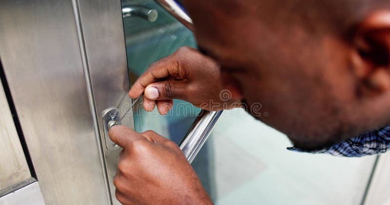 Locksmith Workman Repairing Lock. Lockpicker Worker Stock Photo - Image ...