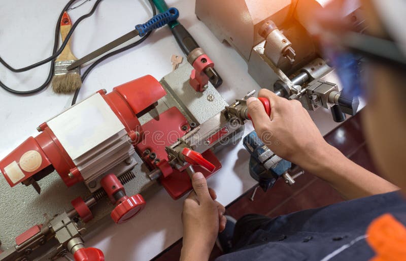 Locksmith, key duplication stock photo. Image of industry - 116264340