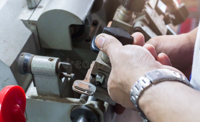 Locksmith, key duplication stock photo. Image of industry - 116264340