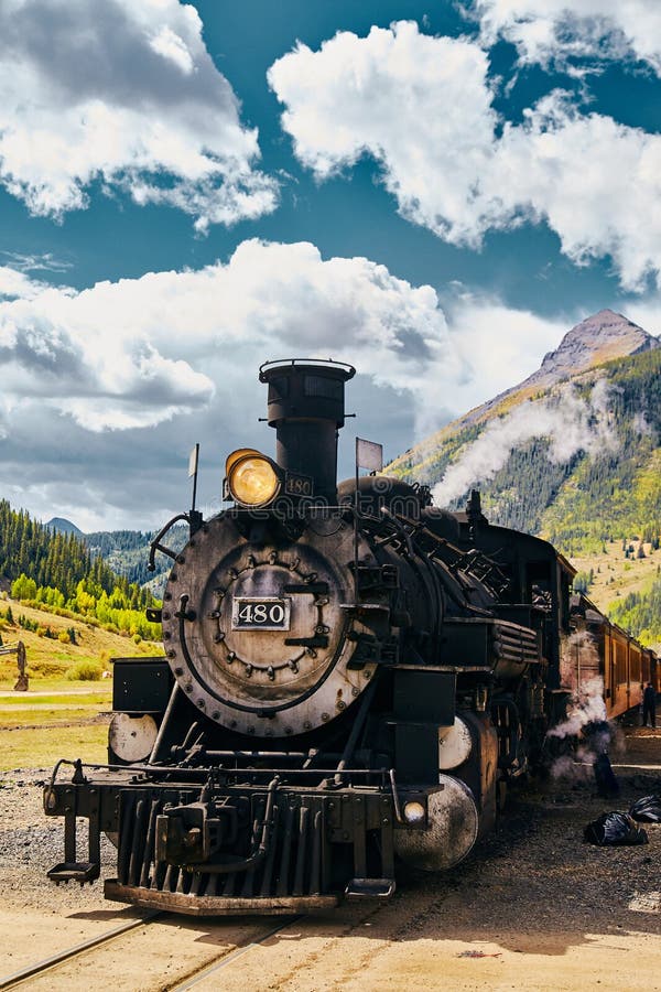Locomotive Coal Train in Midwest Mountains with Large Clouds Editorial ...