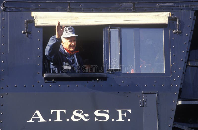 A Locomotive Engineer Waves from the Window of an Engine of the ...