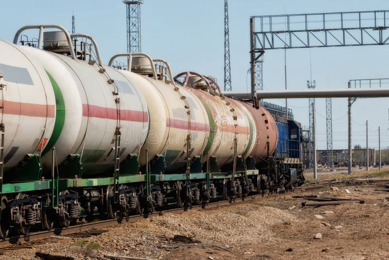 A Locomotive Pulling a Tank of Chemicals on the Rails Stock Photo ...
