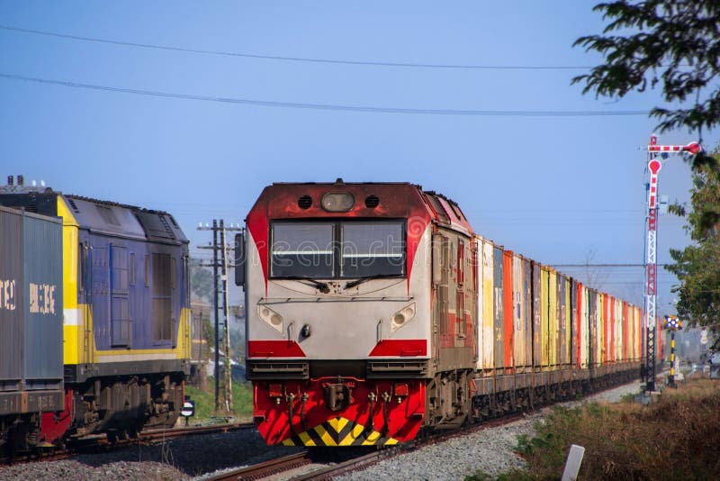 Locomotives with Cargo Container Trains on the Railway. Stock Photo ...