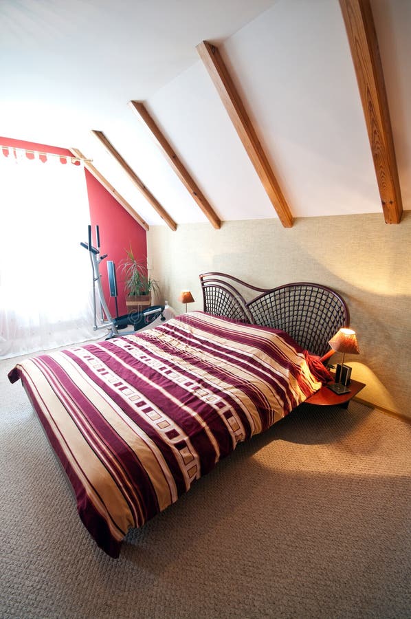 Loft or Attic Bedroom with Slanted Roof Stock Image - Image of curtains ...