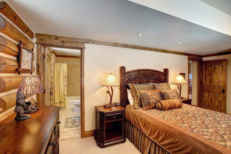 A modern log cabin bedroom stock image. Image of bedspread - 174695123