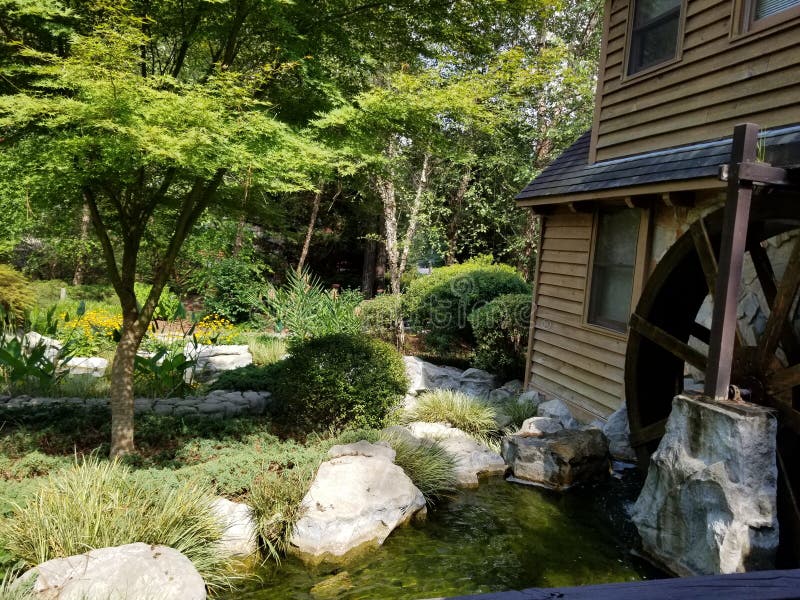 Log cabin at Sycamore stock photo. Image of pond, courtyard - 158203160