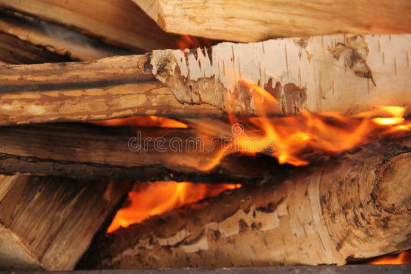 Log in the Flames. Burning Fire in the Grill is Large. Stock Image ...