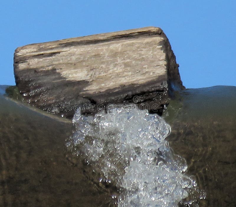 Log hanging on the edge stock photo. Image of hanging - 115486394