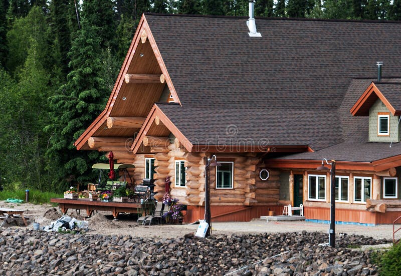 Log Home on a river shore stock image. Image of landscape - 58869915