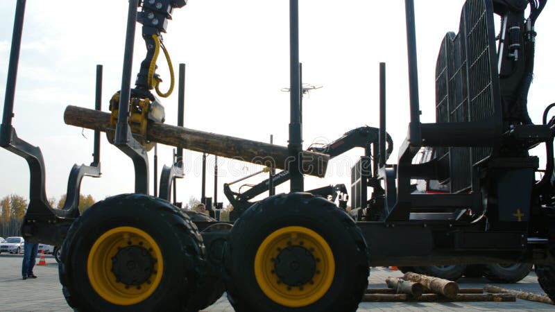 Log Loader or Forestry Machine Moves Fresh Cut Logs for Loading ...