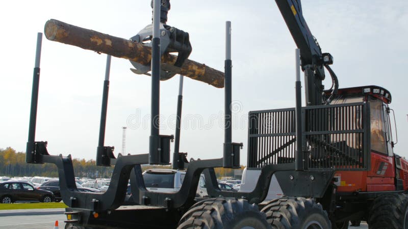 Log Loader or Forestry Machine Moves Fresh Cut Logs for Loading ...