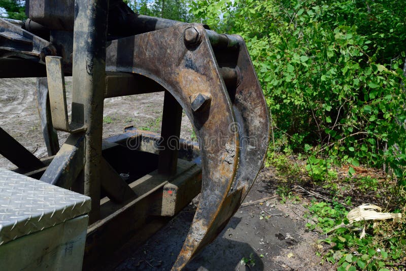 Log Loader Grapple Closeup stock photo. Image of welding - 59195008