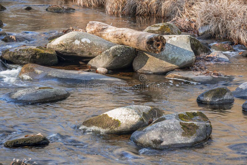 Log on the Rocks in Willard Brook Stock Photo - Image of logs, rocks ...