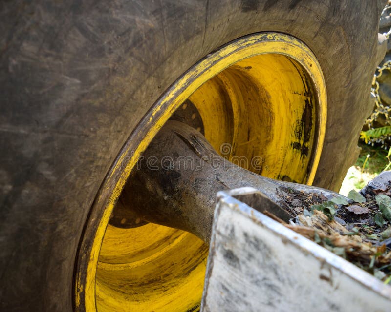 Log Skidder Tire and Axle stock photo. Image of closeup - 59743838