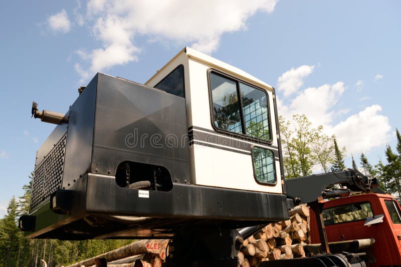 Log Truck and Loader with Wood Piled in Background Stock Image - Image ...
