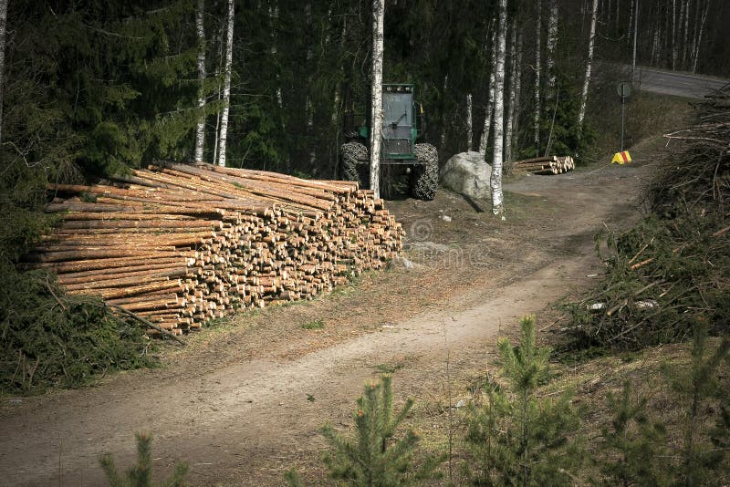 Log trunk harvester stock photo. Image of outdoor, pile - 267218528