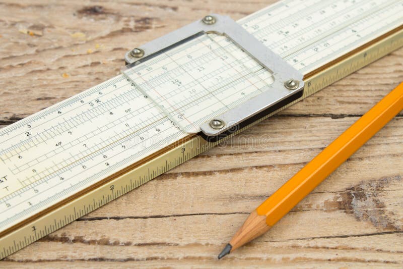 Logarithmic Ruler, Pencil on a Wooden Table. Stationery for Engineers ...