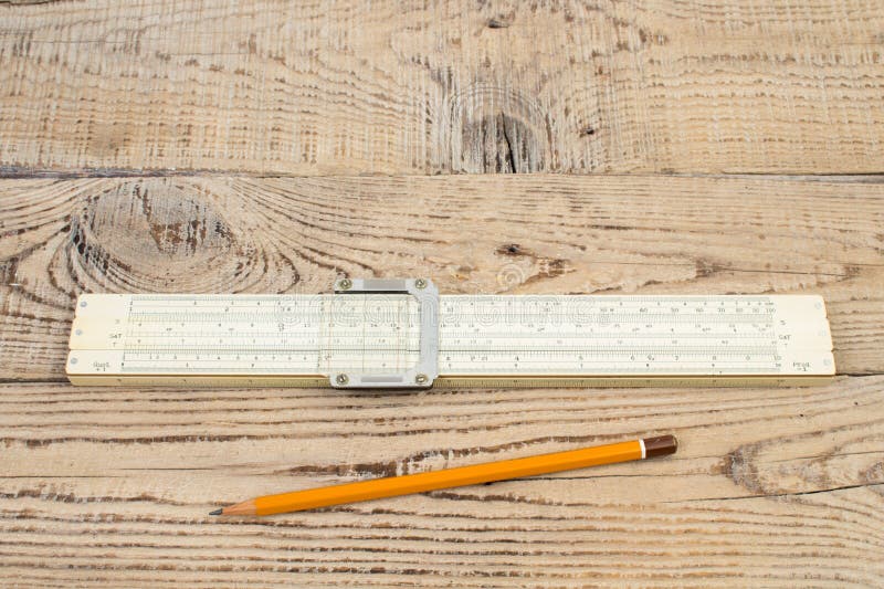 Logarithmic Ruler, Pencil on a Wooden Table. Stationery for Engineers ...