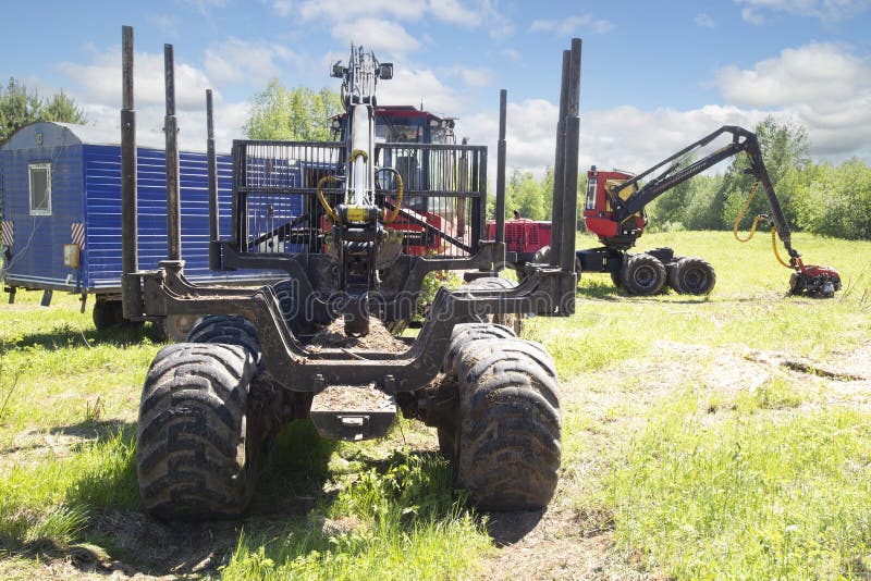 Logging Equipment.Harvester and Forwarder at the Logging Site Stock ...