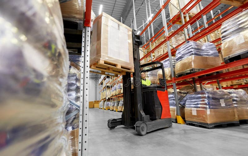 Loader Operating Forklift at Warehouse Stock Photo - Image of industry ...