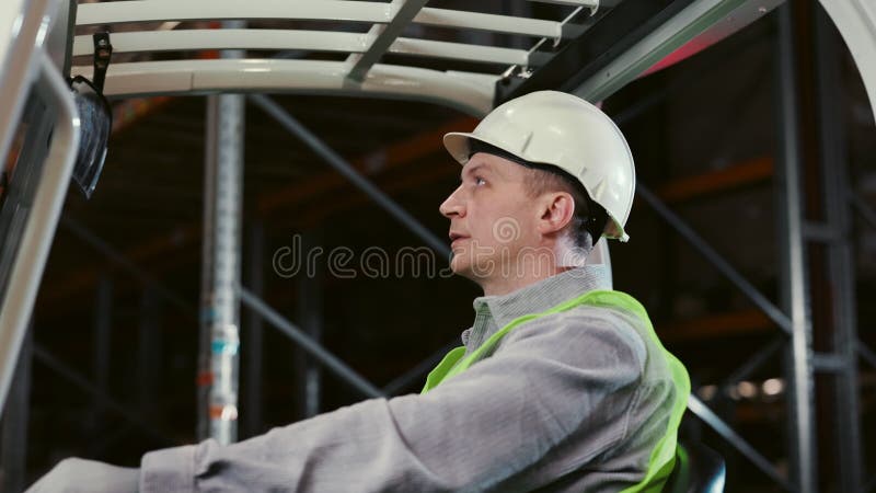 Logistic Guy Caucasian Worker Operating Forklift at Logistic Center ...