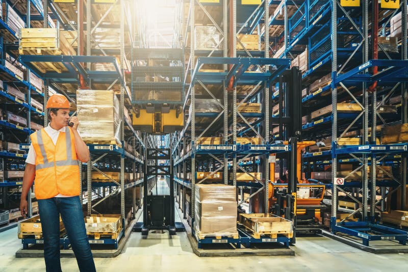 Logistic Warehouse Worker in Helmet. Distribution Warehouse with Many ...
