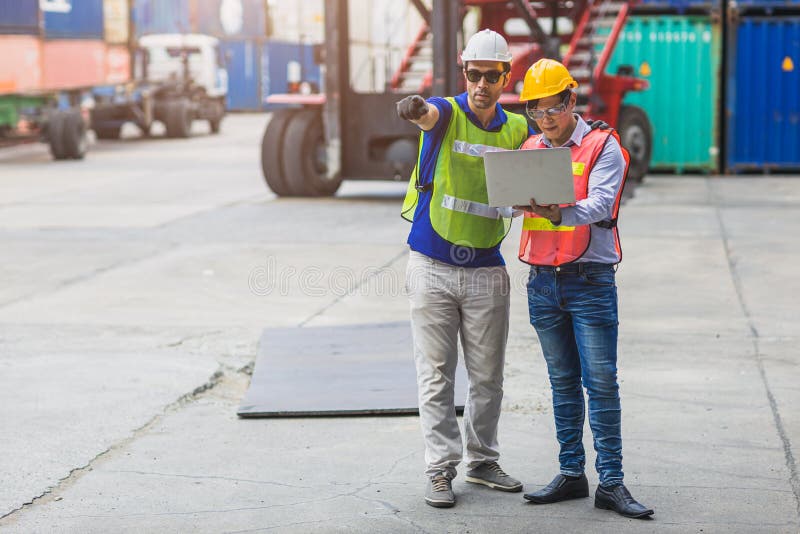 Logistic Worker Mix Race Working Team Together With Online Wireless Laptop Control Loading