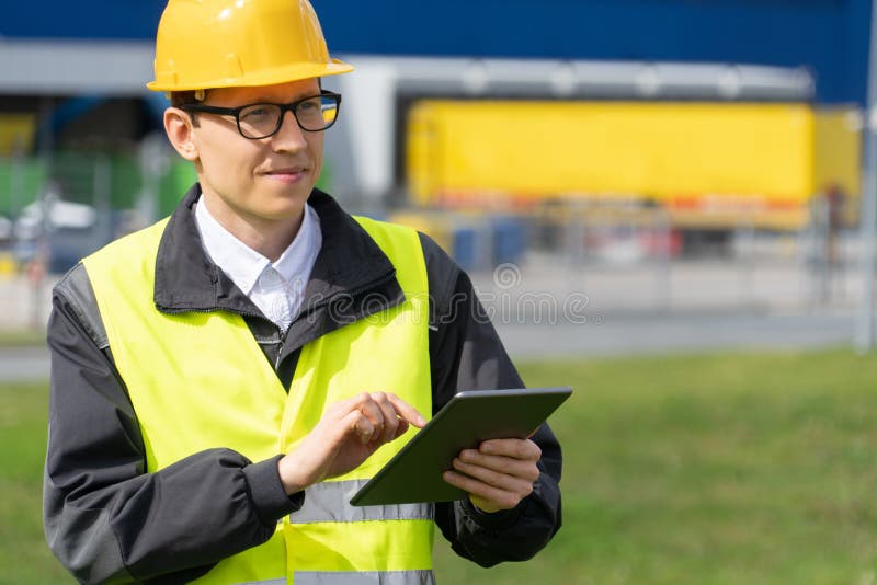 Logistician with Digital Tablet on a Background of Logistic Center ...